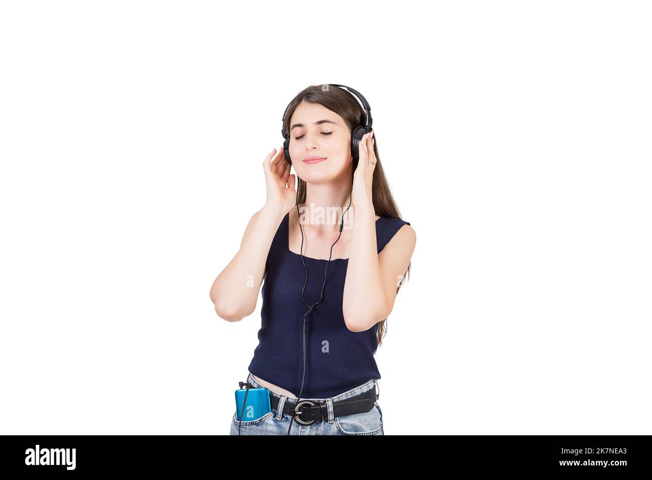 Contented girl listening relaxing music on her phone, keeps hand to ...