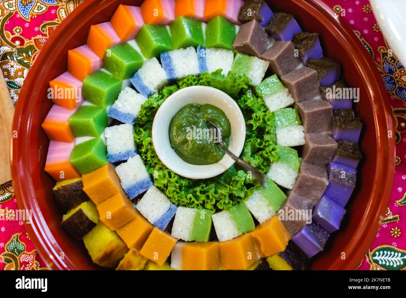 Close up of nyonya kuih (malay cakes) arranged in a beautiful circle on ...