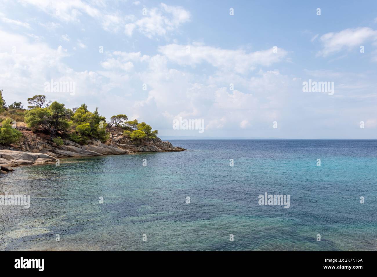 Beautiful Kalogria beach and moody sky. Summer vacation travel holiday ...