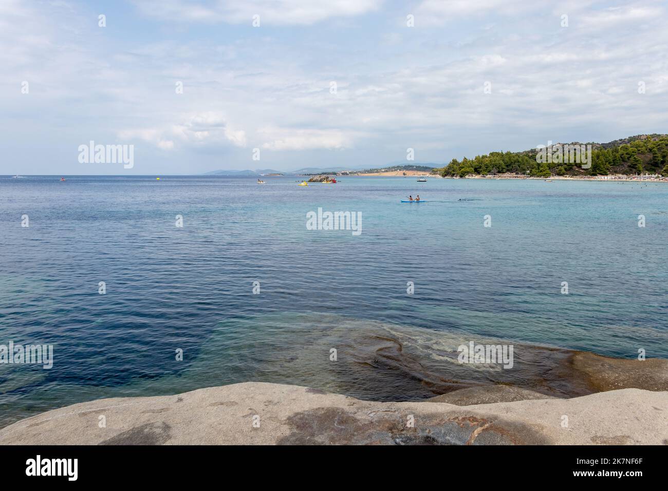 Beautiful Kalogria beach and moody sky. Summer vacation travel holiday ...