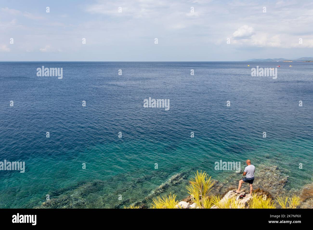 Beautiful Kalogria beach and moody sky. Summer vacation travel holiday ...