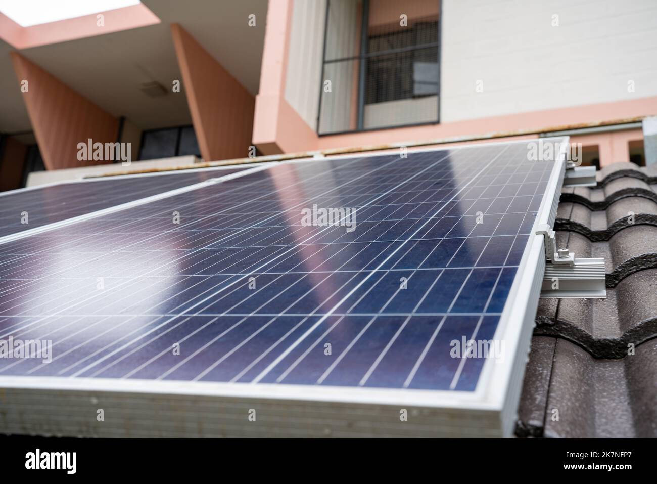 Blue Solar Photo voltaic panels system of apartment building on sunny ...