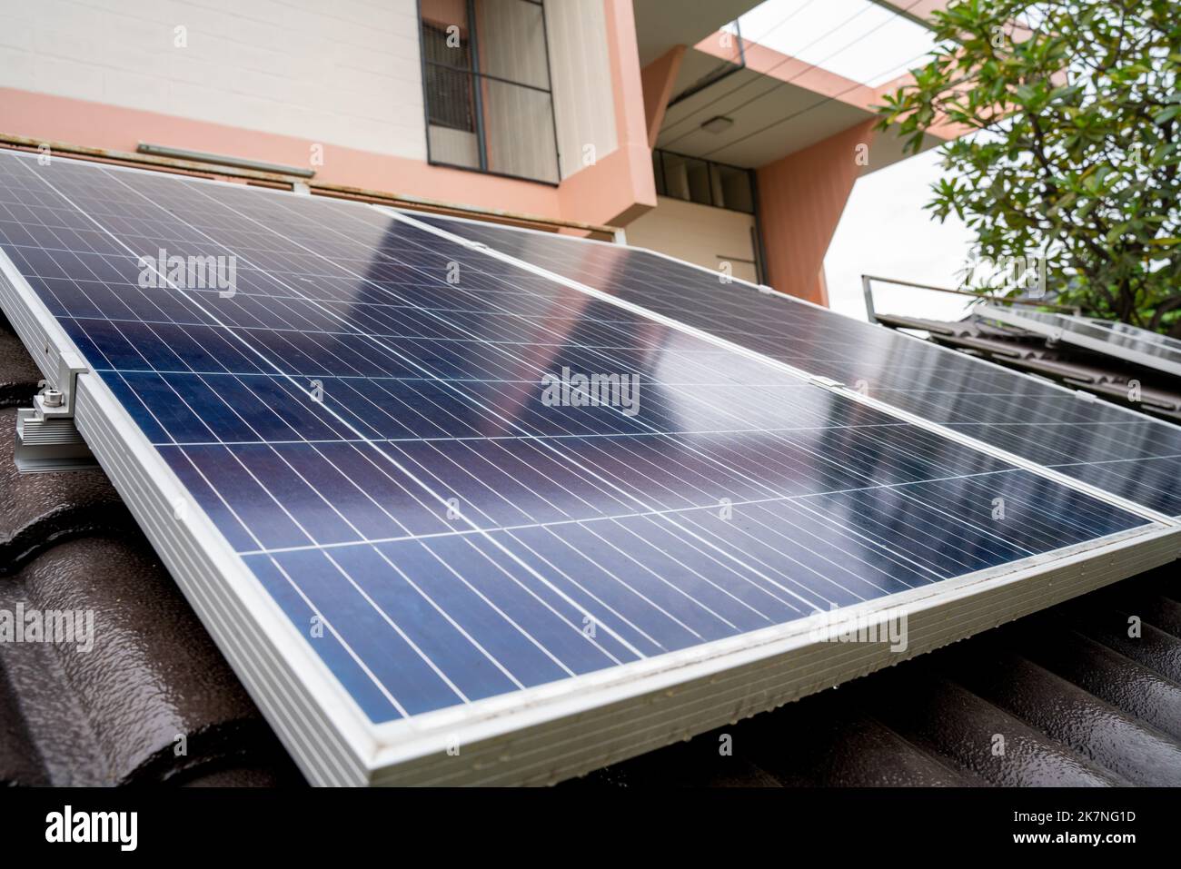 Blue Solar Photo voltaic panels system of apartment building on sunny ...