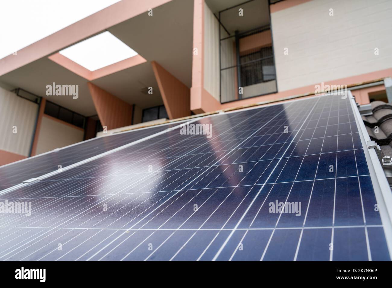 Blue Solar Photo voltaic panels system of apartment building on sunny ...