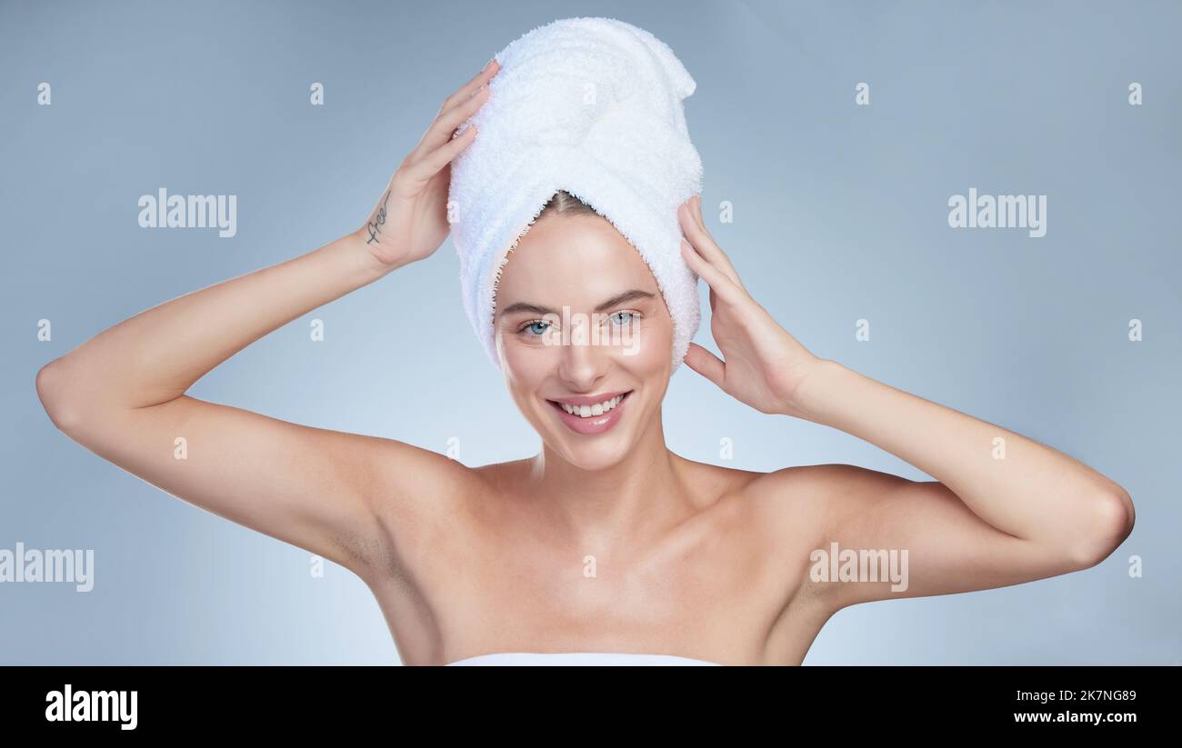 Fresh out the shower. Studio portrait of an attractive young woman ...