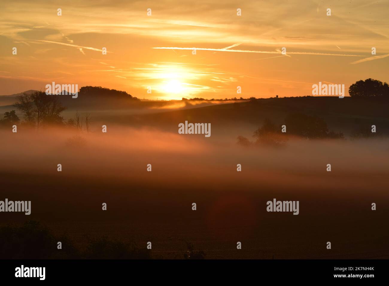 sunrise above low fog Stock Photo - Alamy