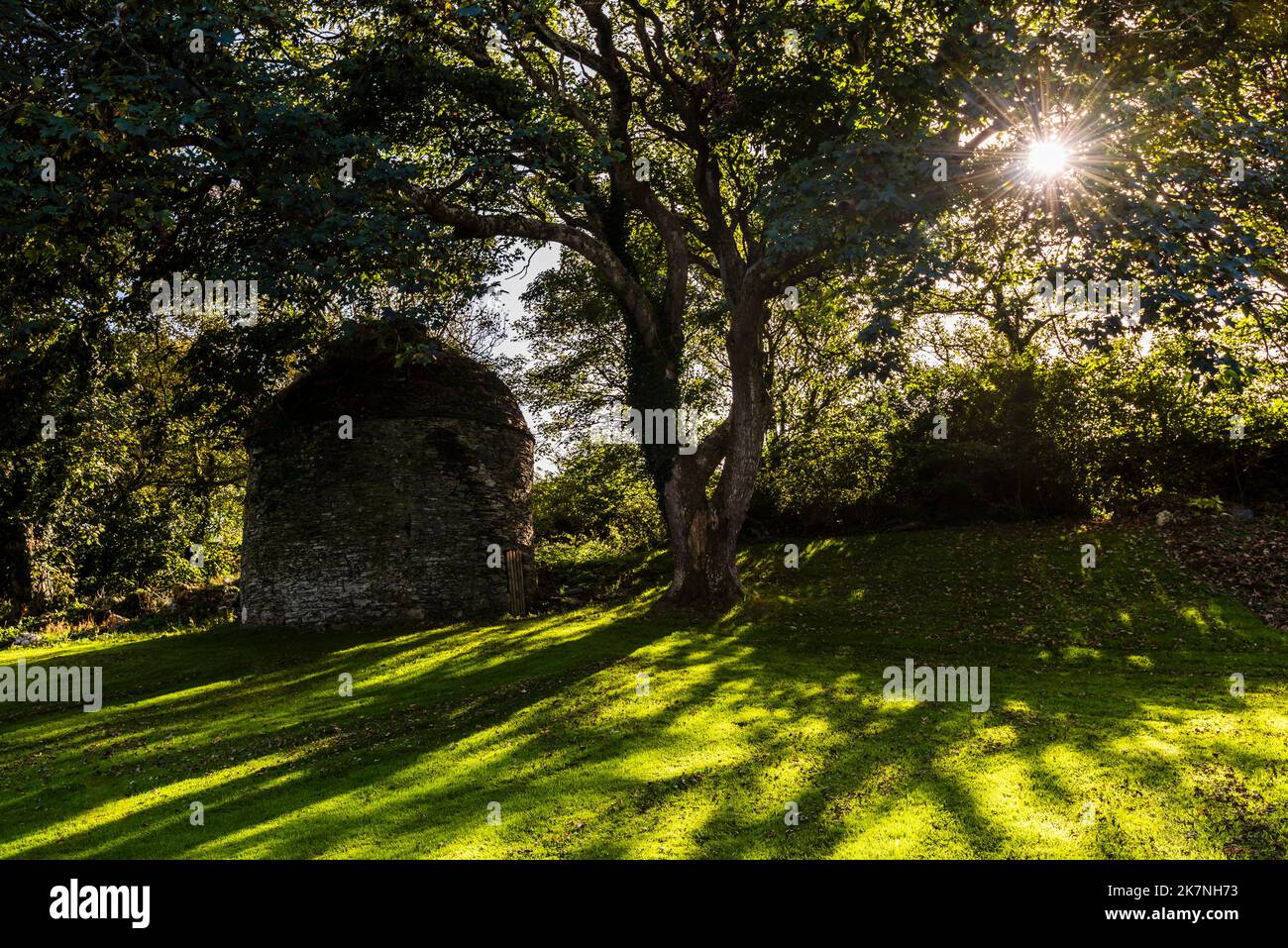 The sun setting over the medieval dovecote in the grounds of The Old ...