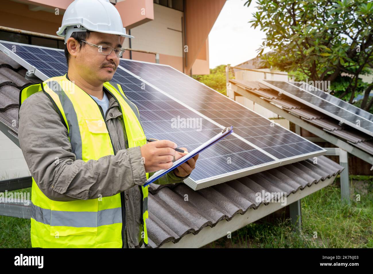 Blue Solar Photo voltaic panels system of apartment building on sunny ...