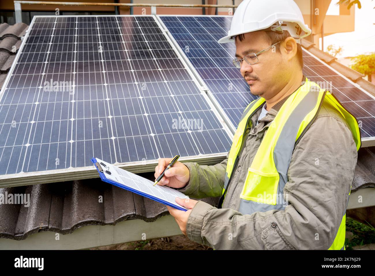 Blue Solar Photo voltaic panels system of apartment building on sunny ...