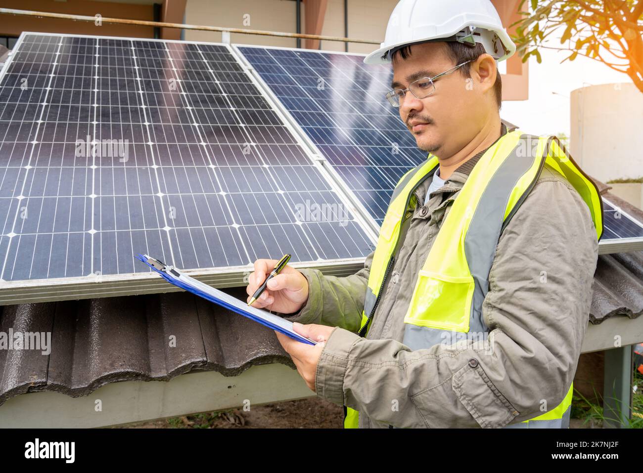 Blue Solar Photo voltaic panels system of apartment building on sunny ...