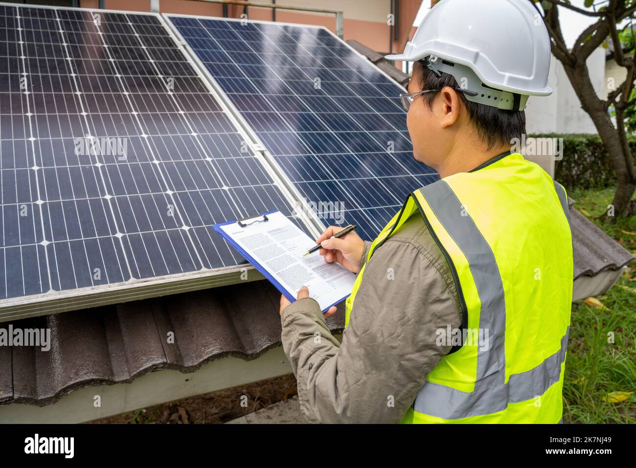 Blue Solar Photo voltaic panels system of apartment building on sunny ...