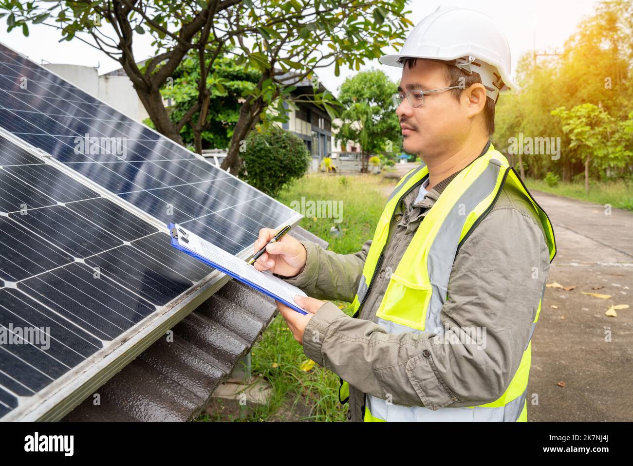 Blue Solar Photo voltaic panels system of apartment building on sunny ...
