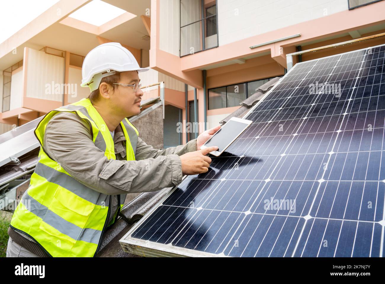 Blue Solar Photo voltaic panels system of apartment building on sunny ...