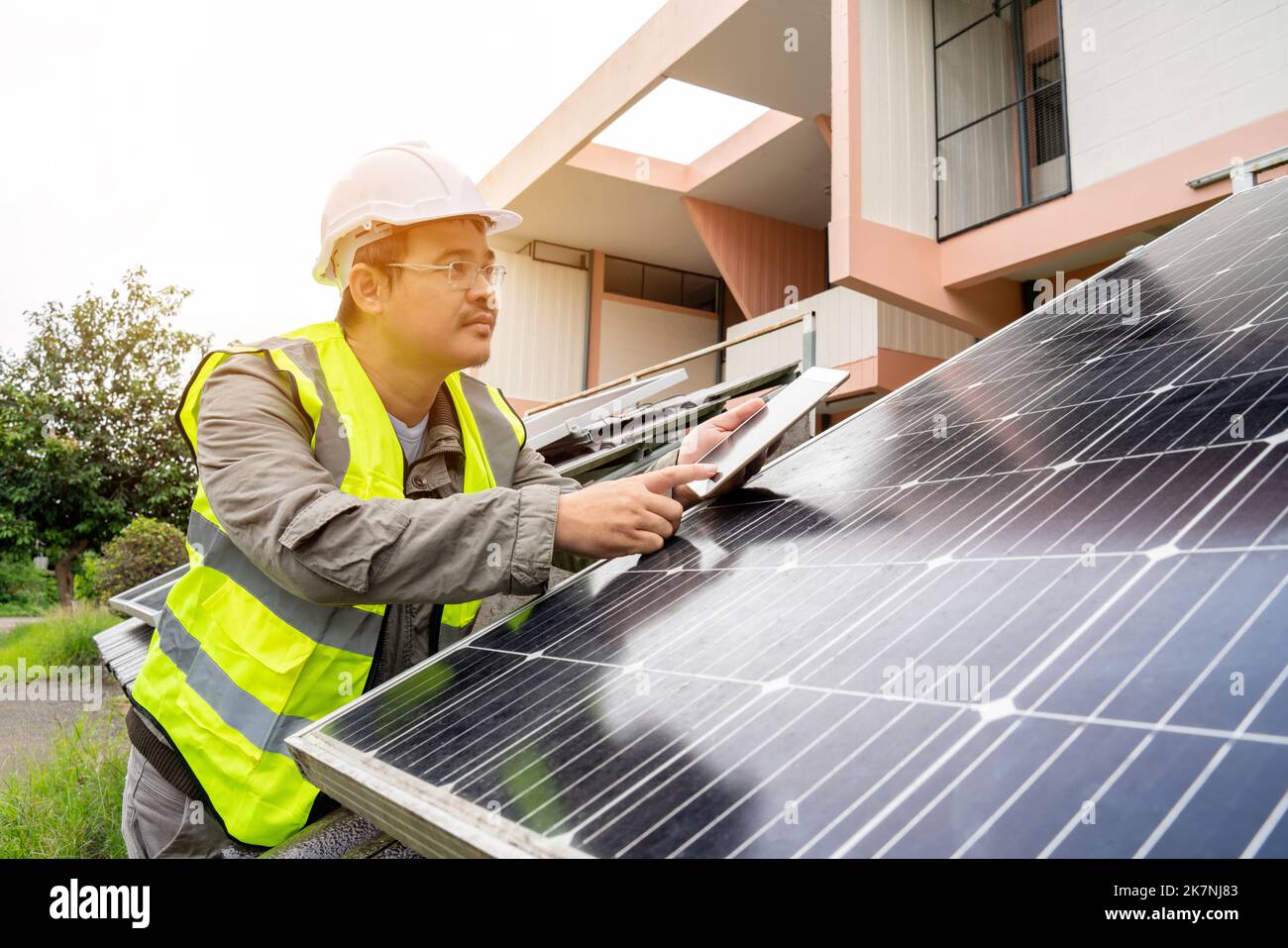 Blue Solar Photo voltaic panels system of apartment building on sunny ...