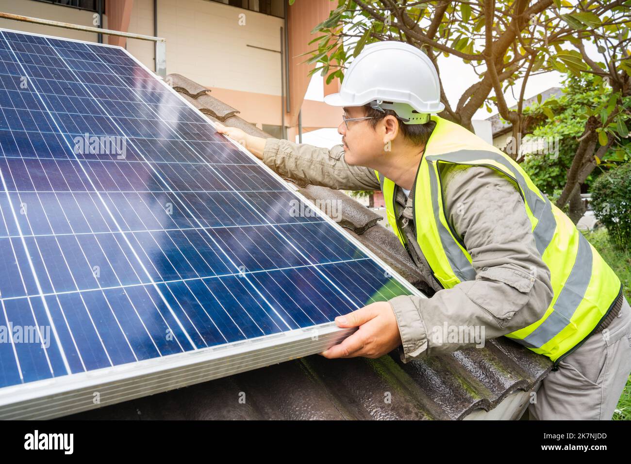 Blue Solar Photo voltaic panels system of apartment building on sunny ...