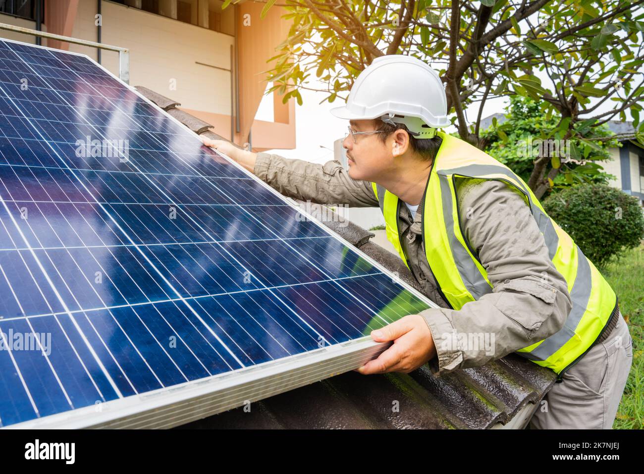 Blue Solar Photo voltaic panels system of apartment building on sunny ...