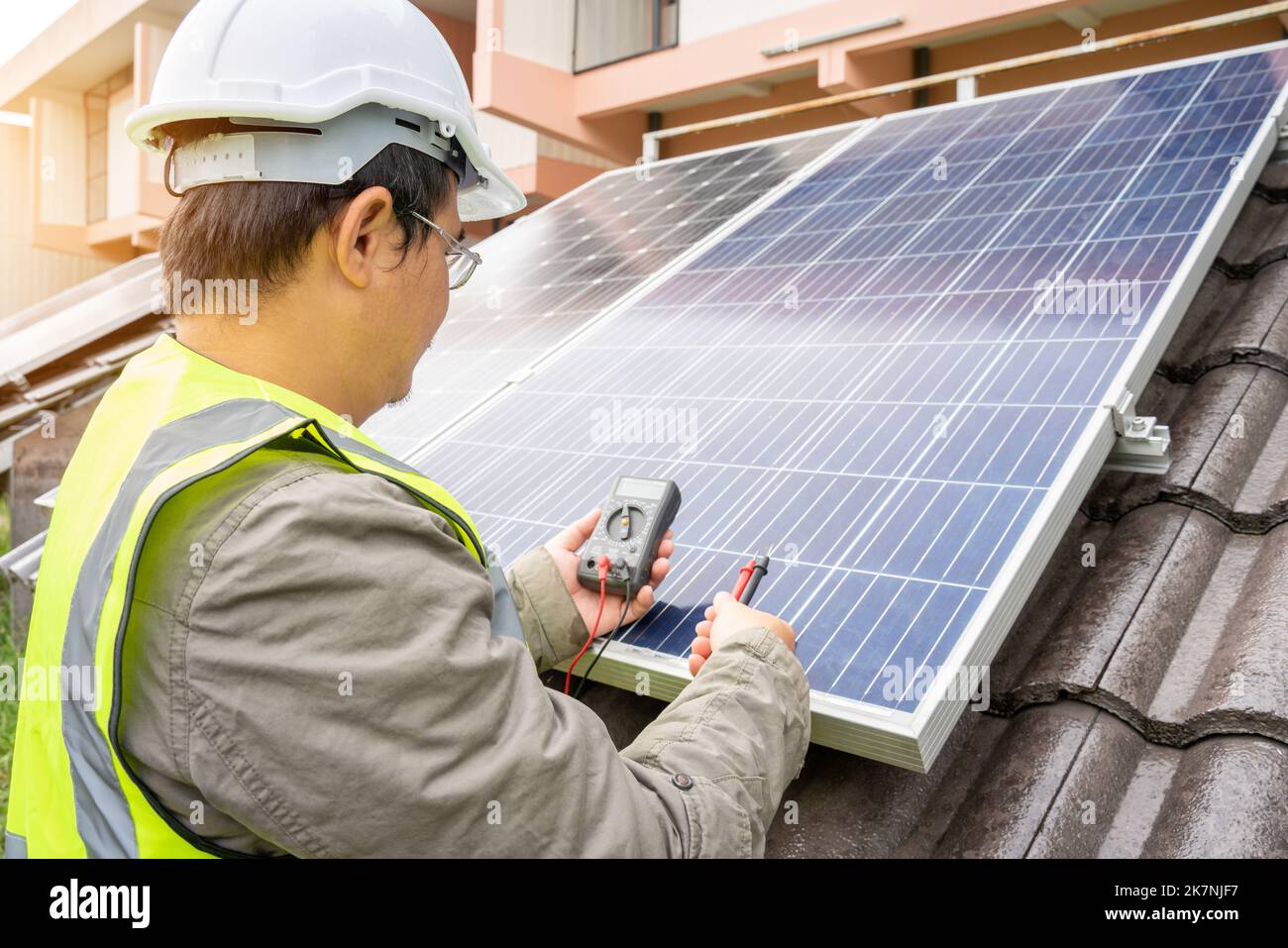 Blue Solar Photo voltaic panels system of apartment building on sunny ...