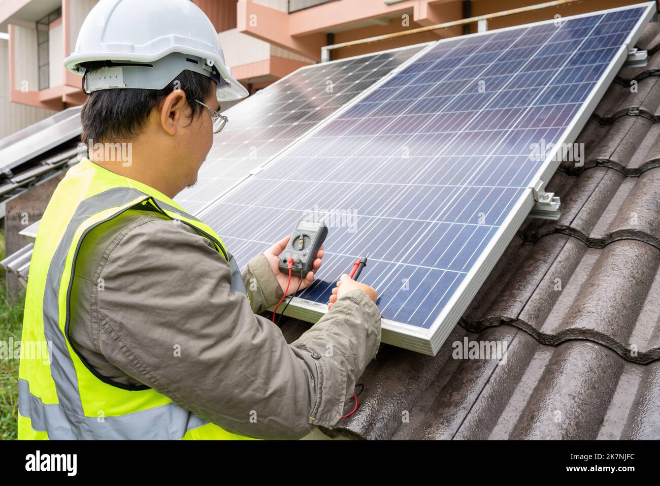 Blue Solar Photo voltaic panels system of apartment building on sunny ...