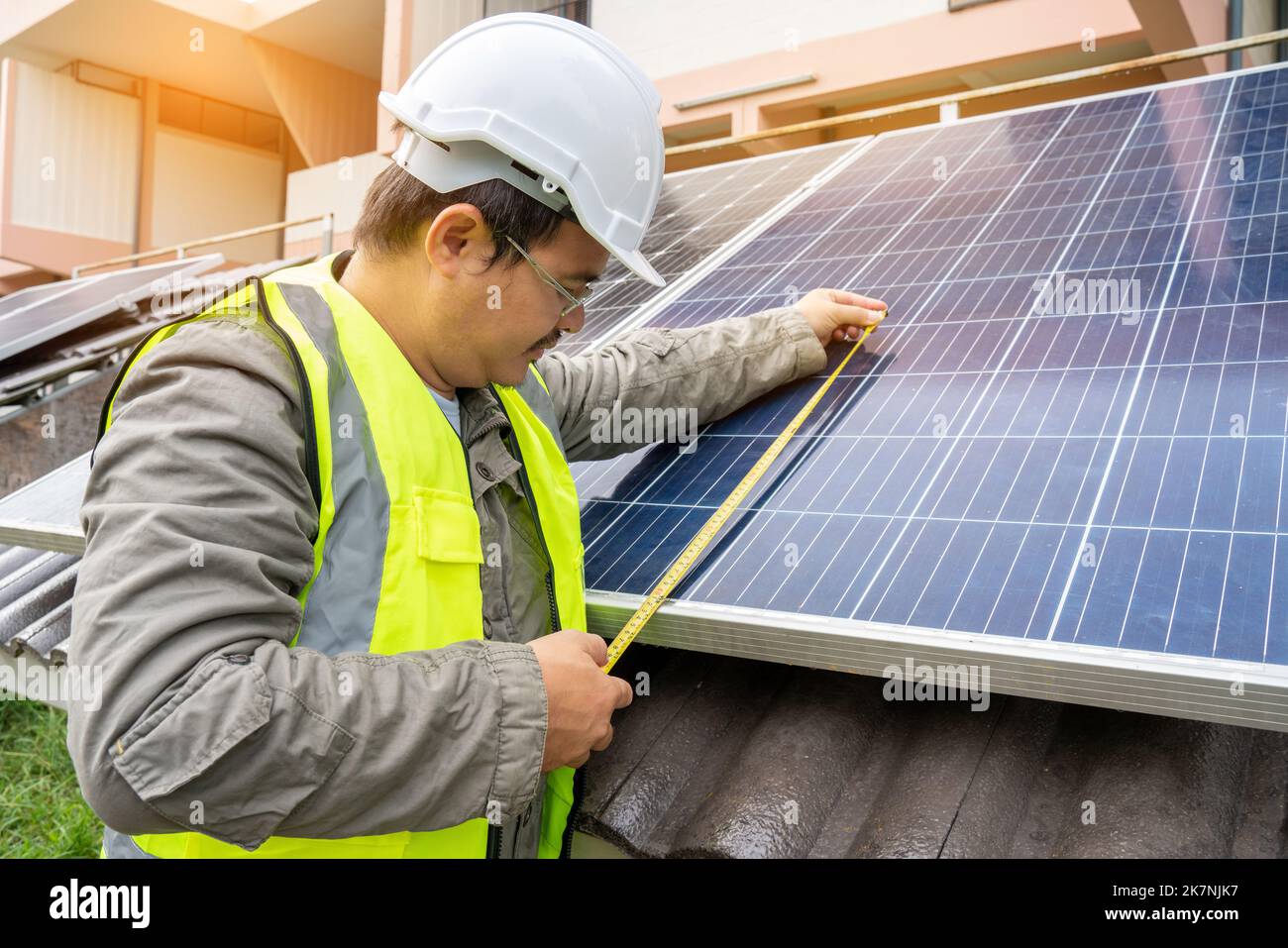 Blue Solar Photo voltaic panels system of apartment building on sunny ...