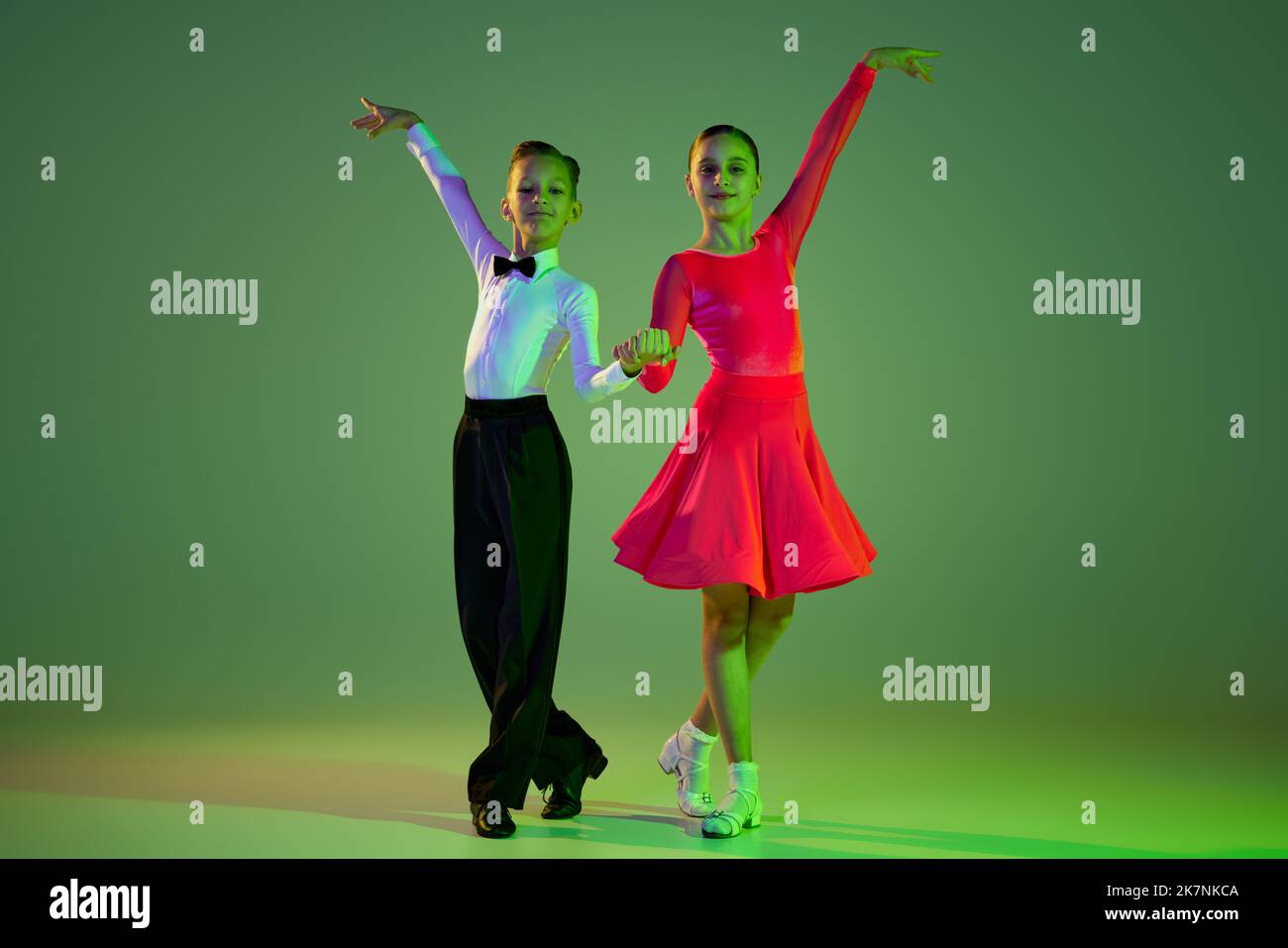 Beginner dancers. Portrait of beautiful little boy and girl dancing ...