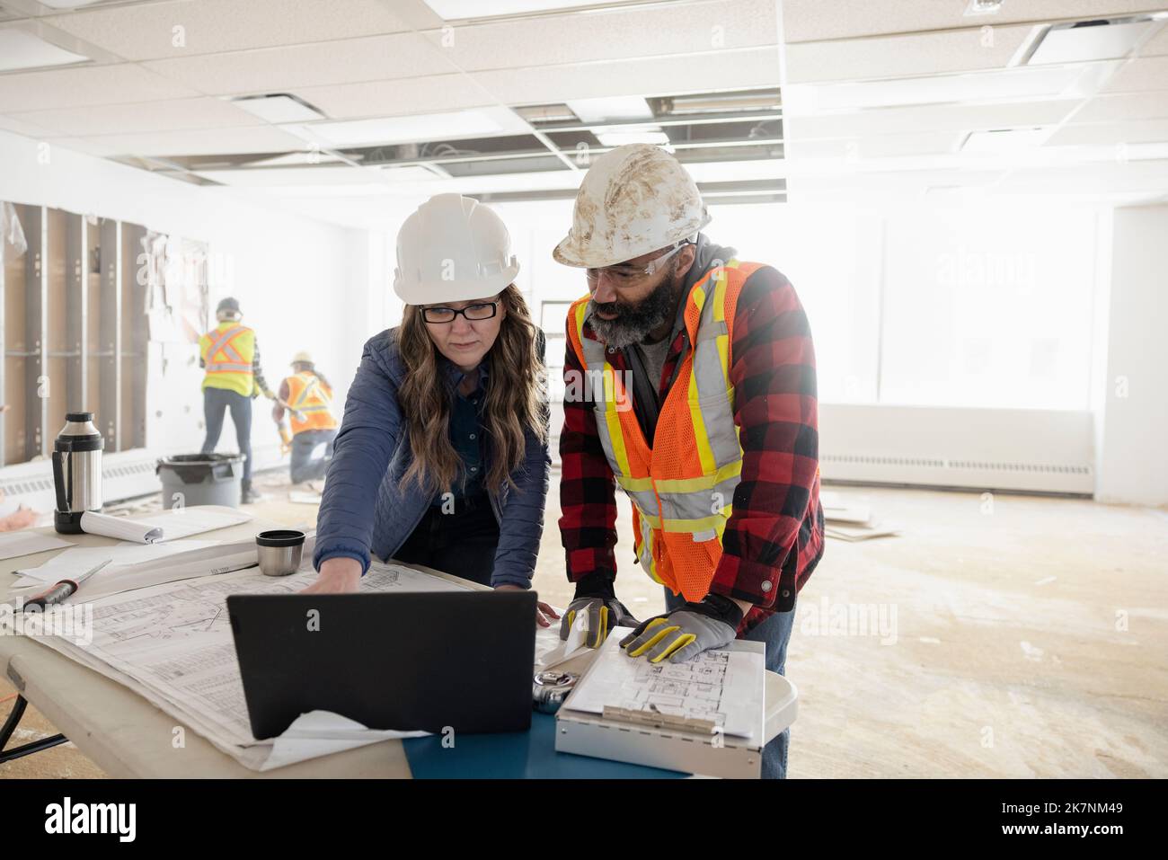 Construction manager with new building hi-res stock photography and ...