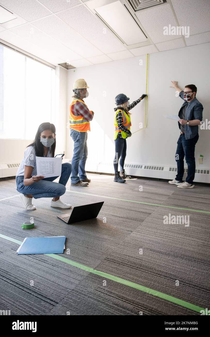 New tenants planning layout of new office Stock Photo - Alamy