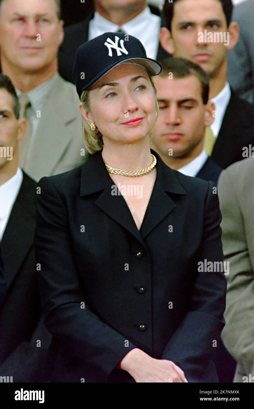 U.S First Lady Hillary Clinton wears a New York Yankee baseball hat ...