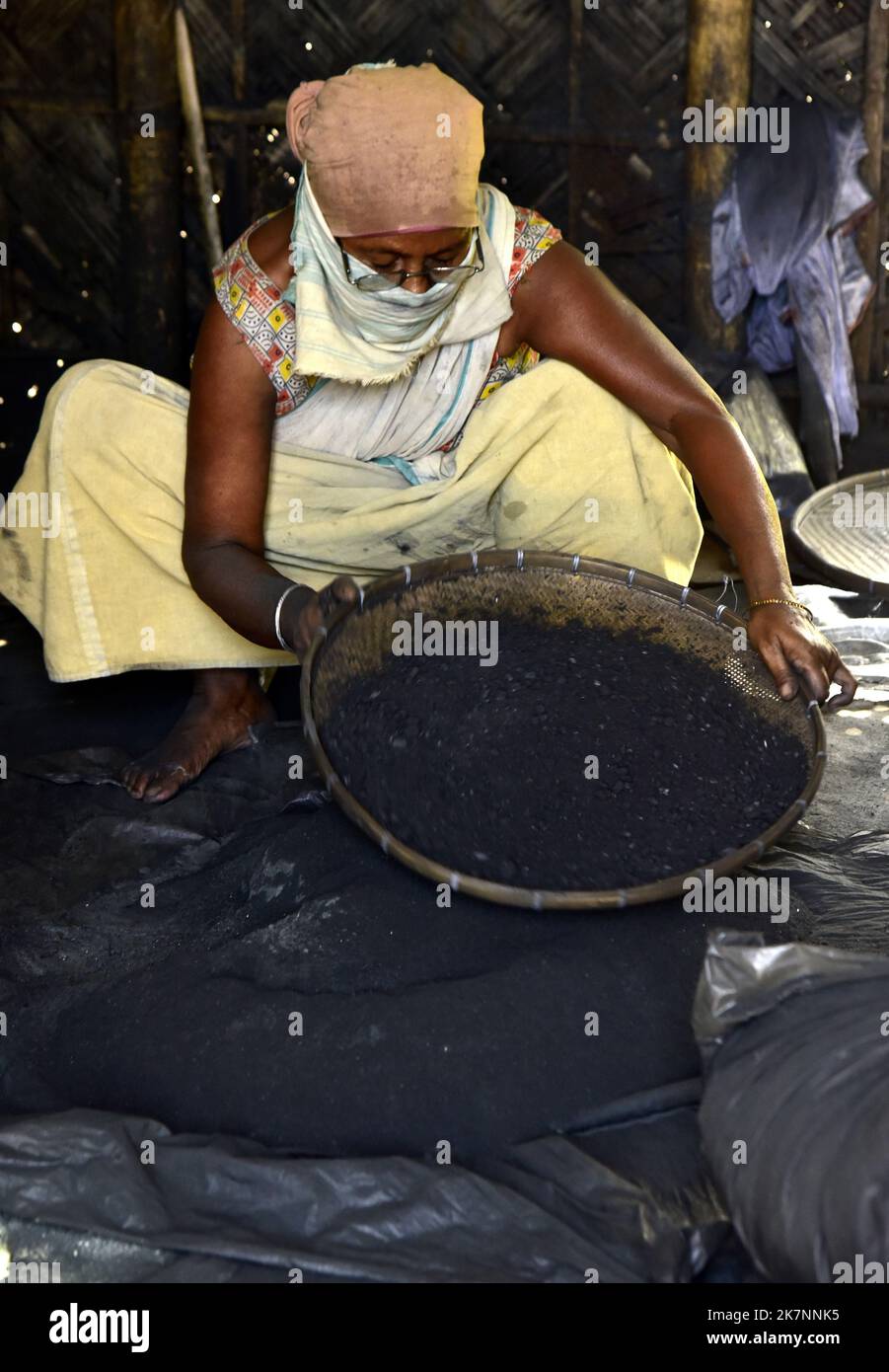 Guwahati, Guwahati, India. 17th Oct, 2022. A woman preparing powder of ...