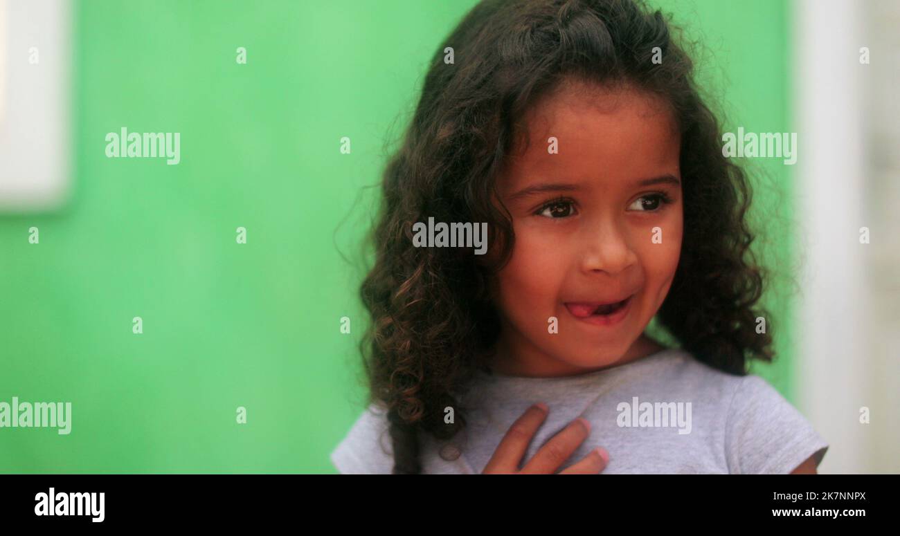 Cute Brazilian little girl child. shy kid Stock Photo - Alamy