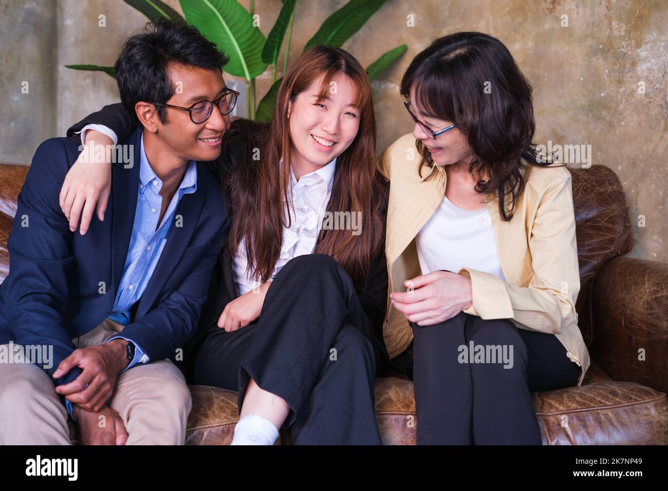 Three co-workers from different cultures together taking a break in the ...