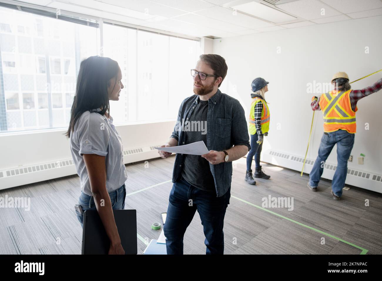 New tenants planning office remodel Stock Photo - Alamy