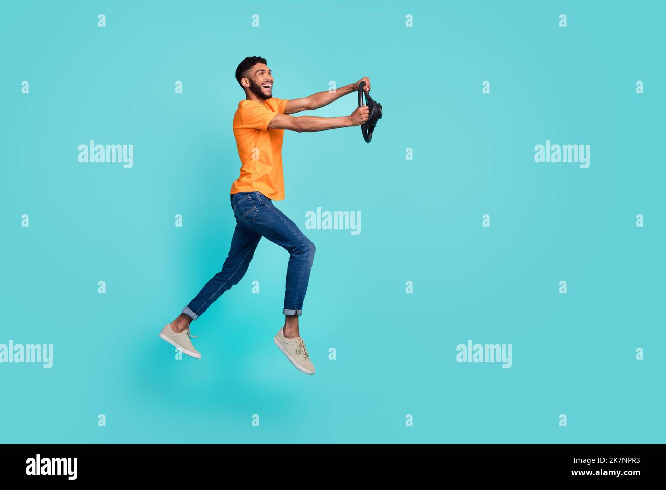 Full size profile photo of crazy cheerful person arms hold wheel jump ...