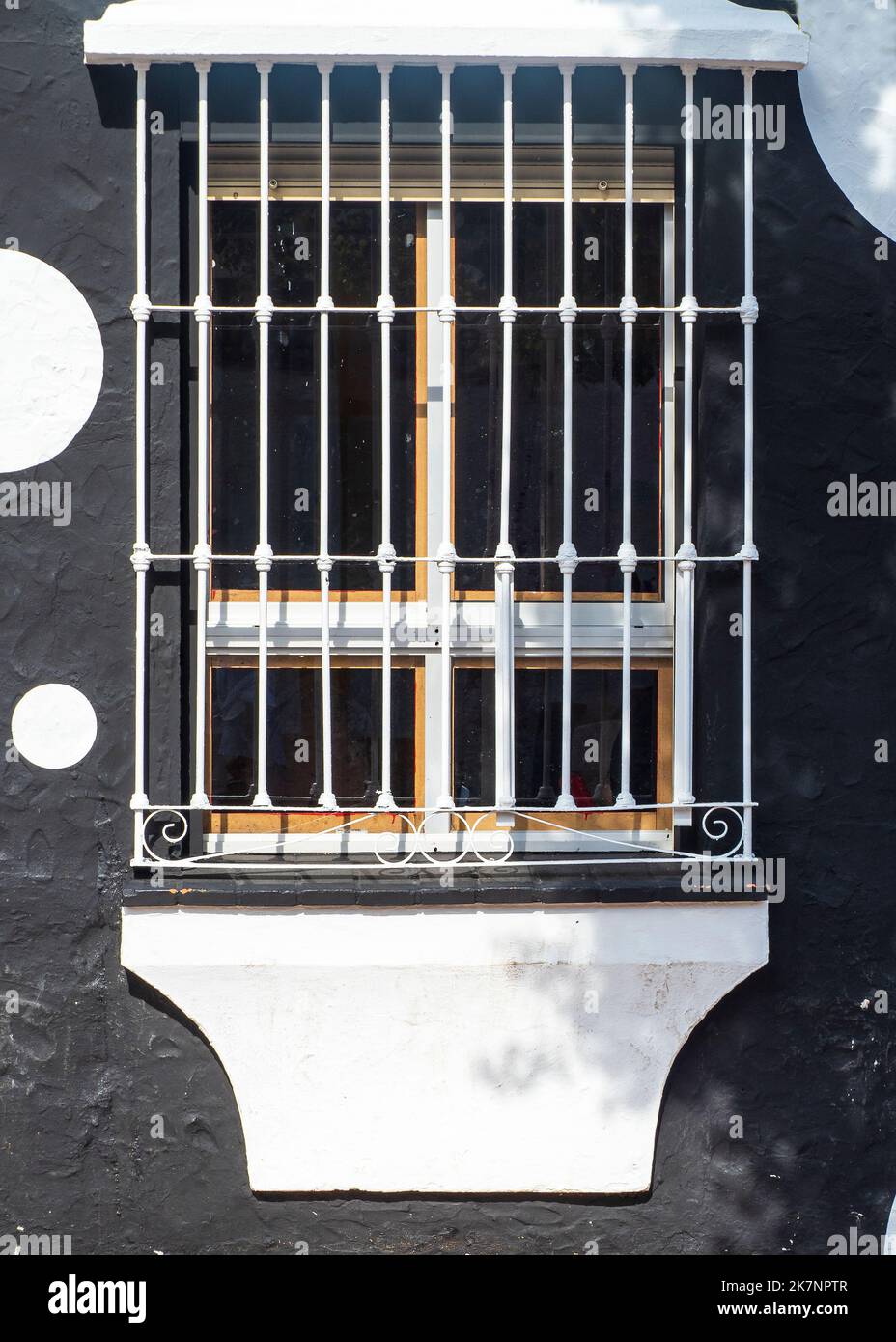 Andalusian style façade with black and white colours Stock Photo - Alamy