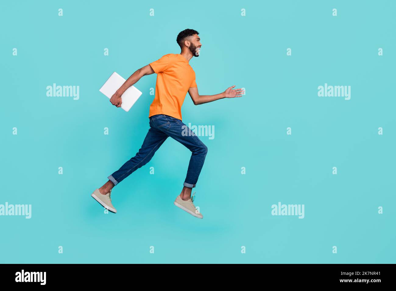 Full length profile photo of crazy guy jump hurry rush empty space hold ...