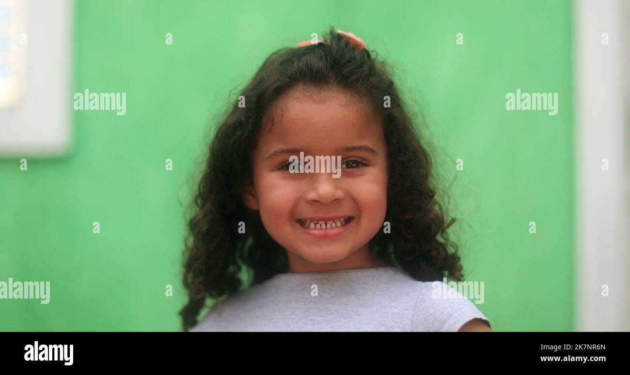 Brazilian child smiling. hispanic kid girl smile Stock Photo - Alamy