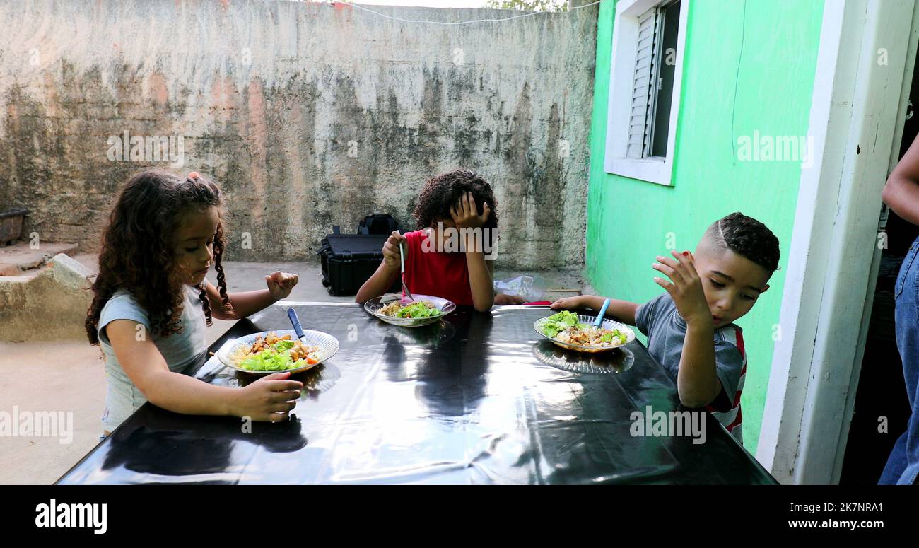 Brazilian children eating lunch. Hispanic south american kids eat food ...
