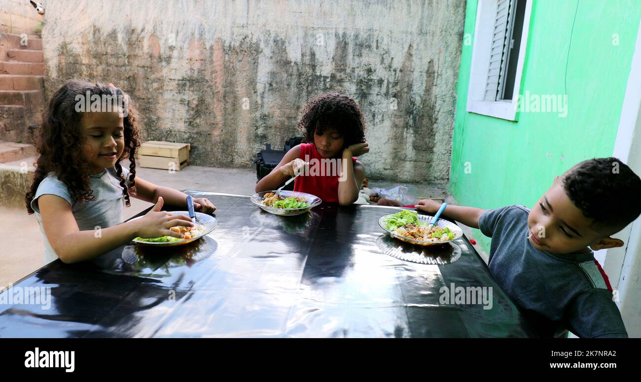Brazilian children eating lunch. Hispanic south american kids eat food ...