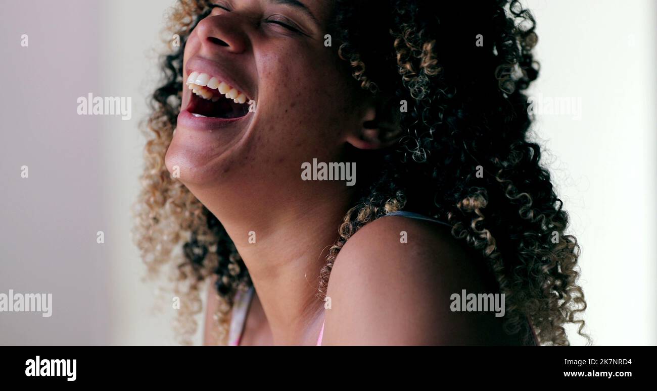 Happy Brazilian young woman laughing and smiling. hispanic black woman ...
