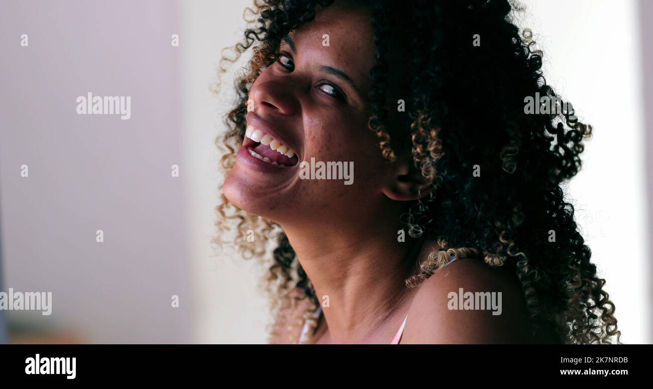 Happy Brazilian young woman laughing and smiling. hispanic black woman ...