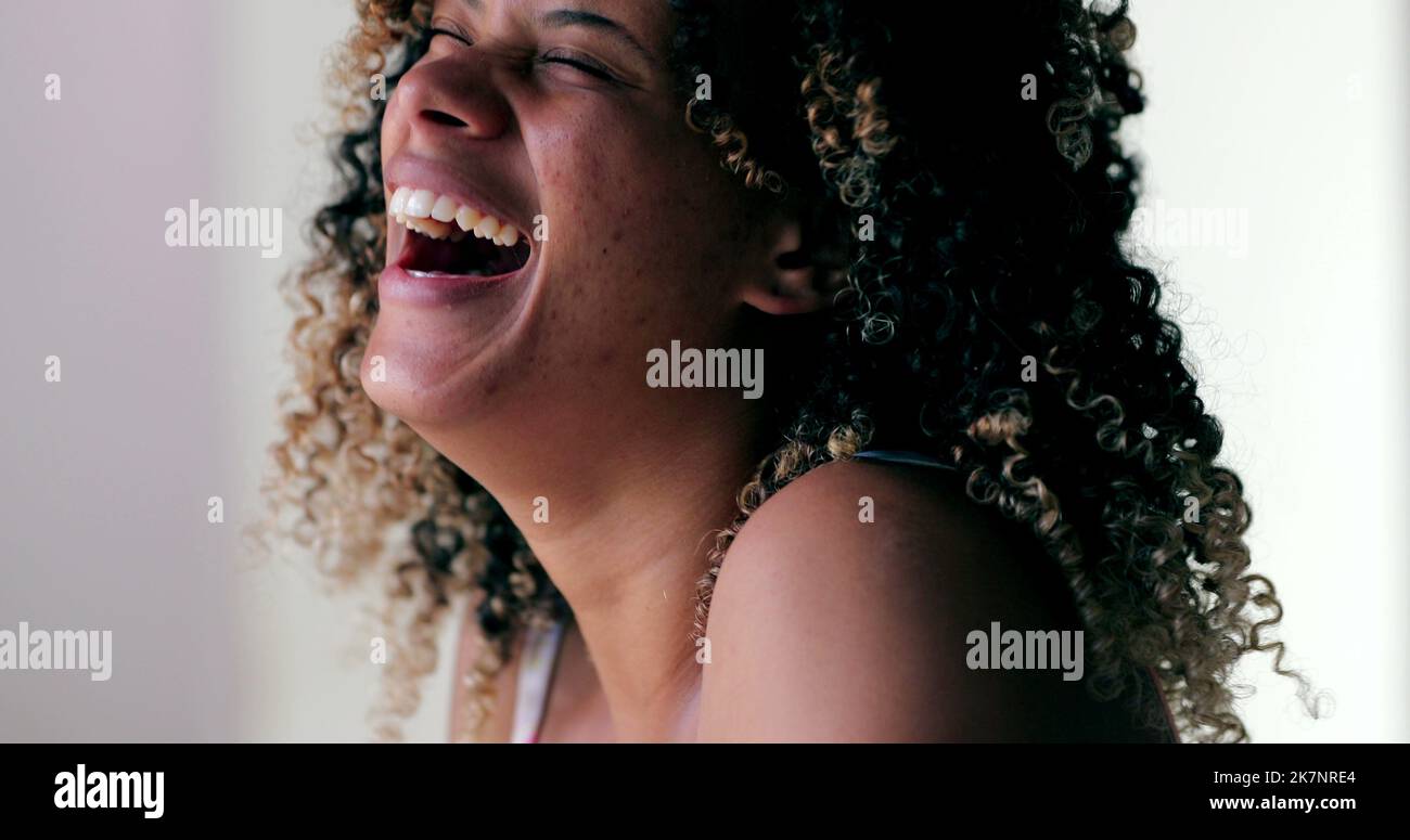 Happy Brazilian young woman laughing and smiling. hispanic black woman ...