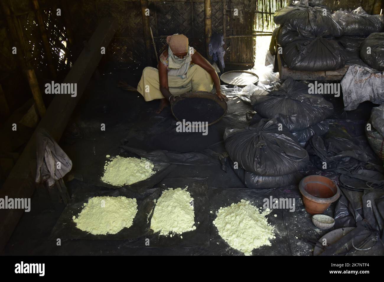 Guwahati, Guwahati, India. 17th Oct, 2022. A woman preparing powder of ...