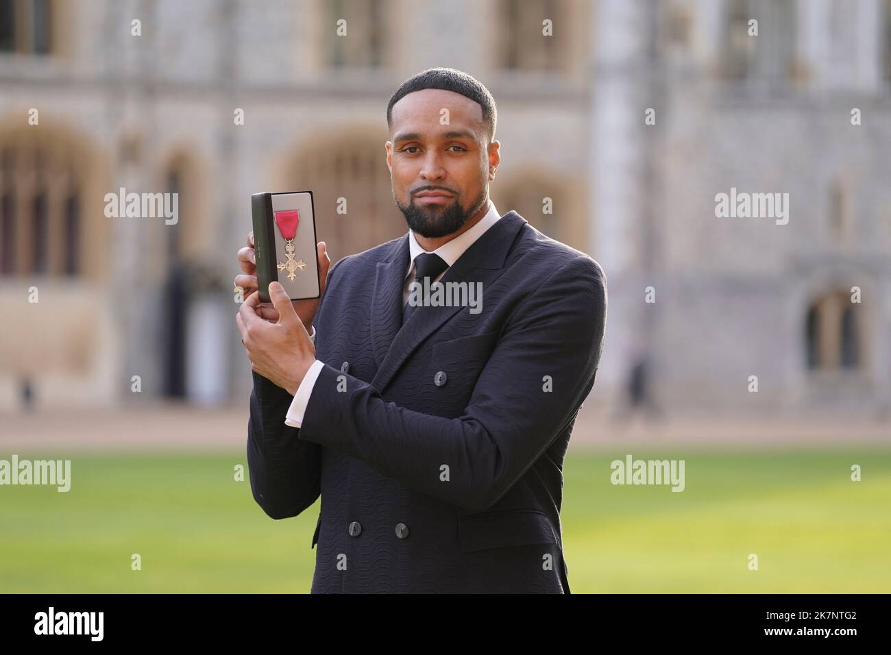 Ashley Banjo holds his British Empire Medal after being made an MBE ...