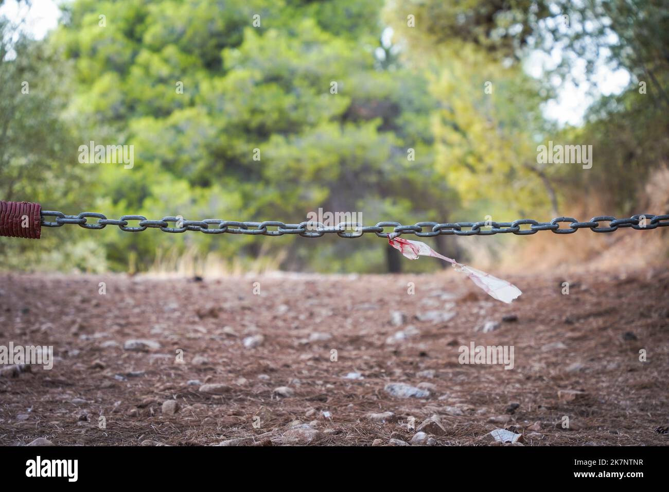Metal chain blocking entrance of trail in mountain area, Spain Stock ...