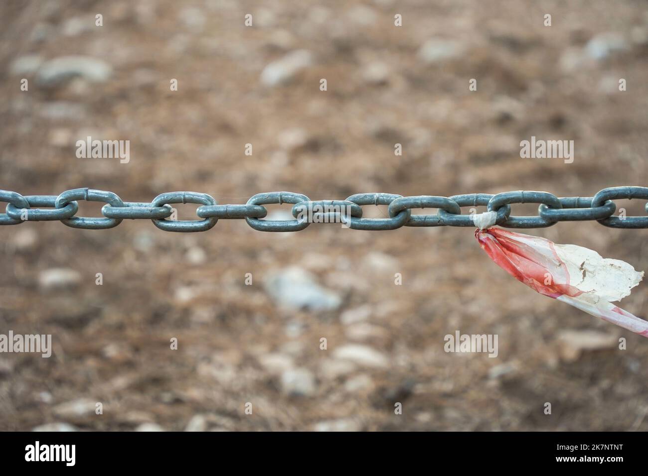 Metal chain blocking entrance of trail in mountain area, Spain Stock ...
