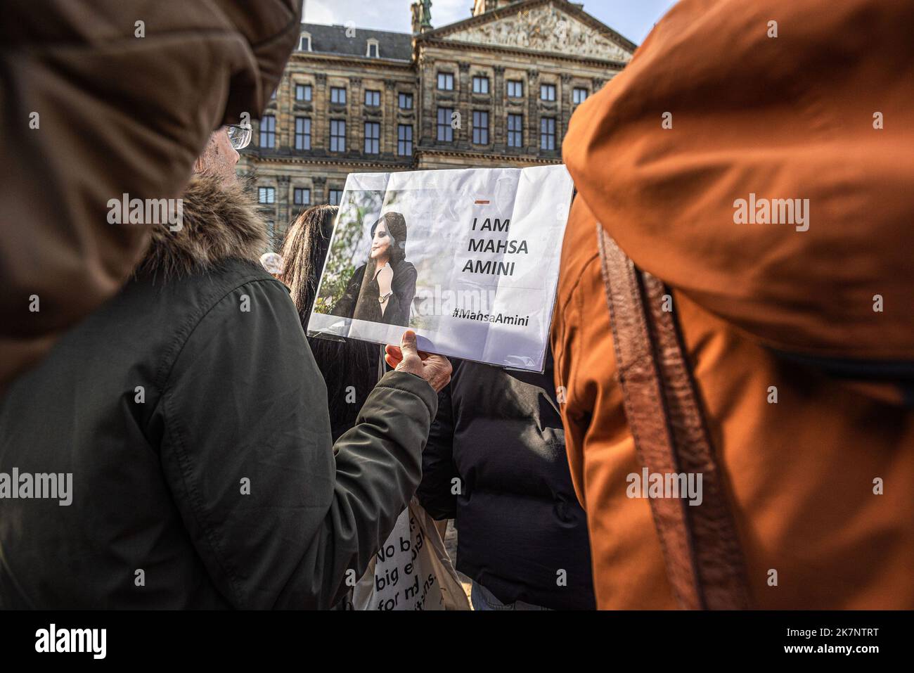 A woman holds a portrait of Mahsa Amini, during the ‘Woman Life Freedom ...