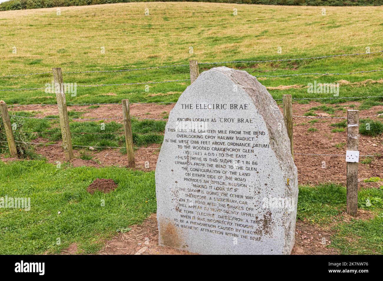A stone marking Electric Brae or Croy Brae, a road giving an optical ...
