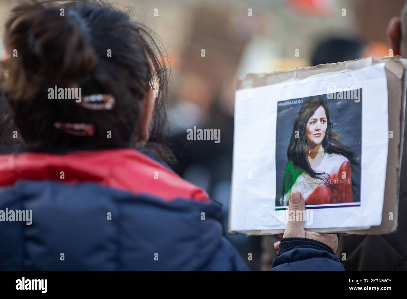 A Woman Holds A Portrait Of Mahsa Amini During The ‘woman Life Freedom