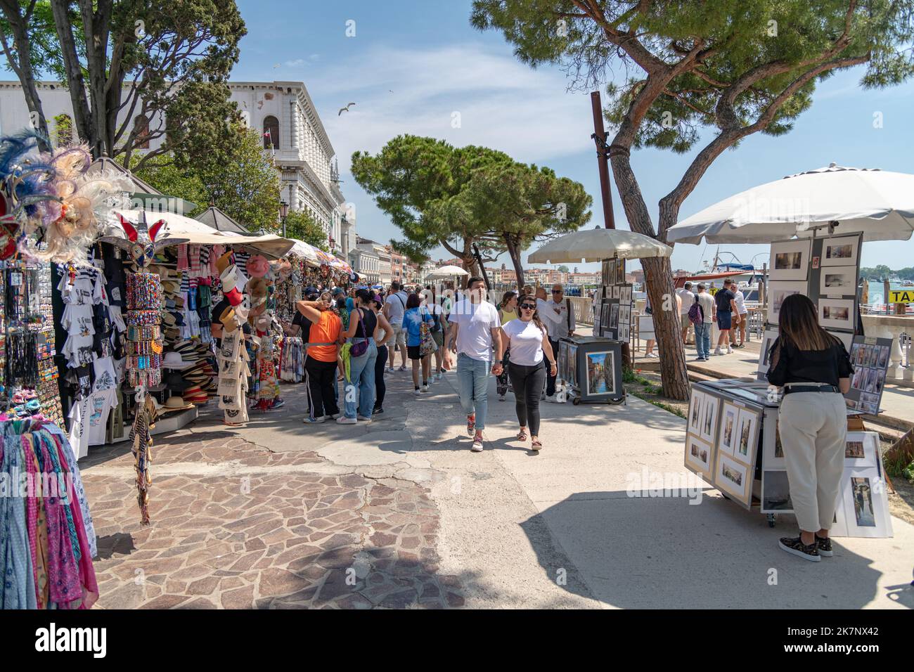 People exploring and shopping at a street market in Venice, Italy Stock ...