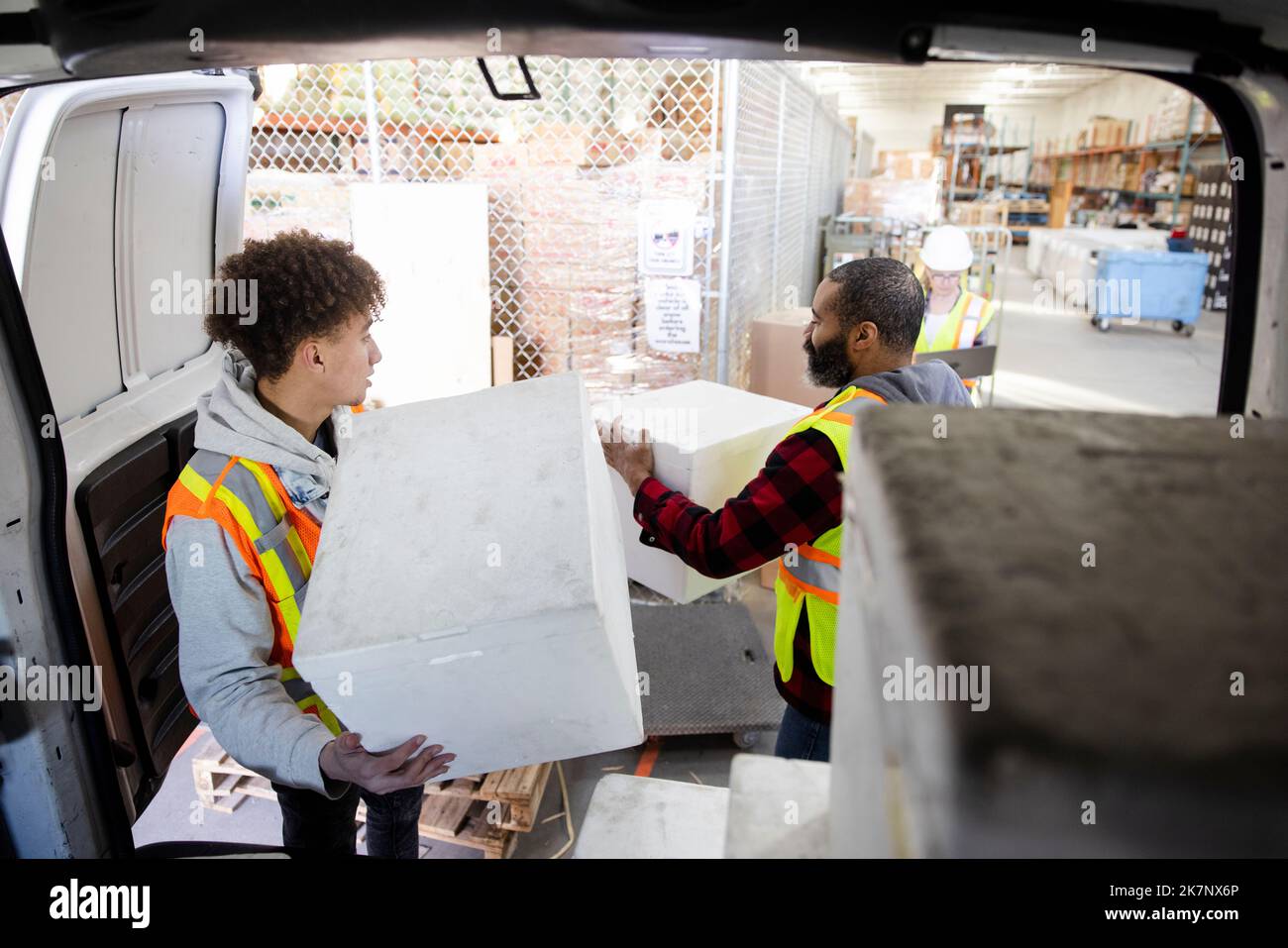 Worker unloading boxes hi-res stock photography and images - Alamy