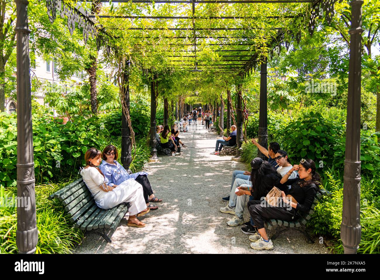 People sitting on benches in the Giardini Reali / Royal Gardens in ...